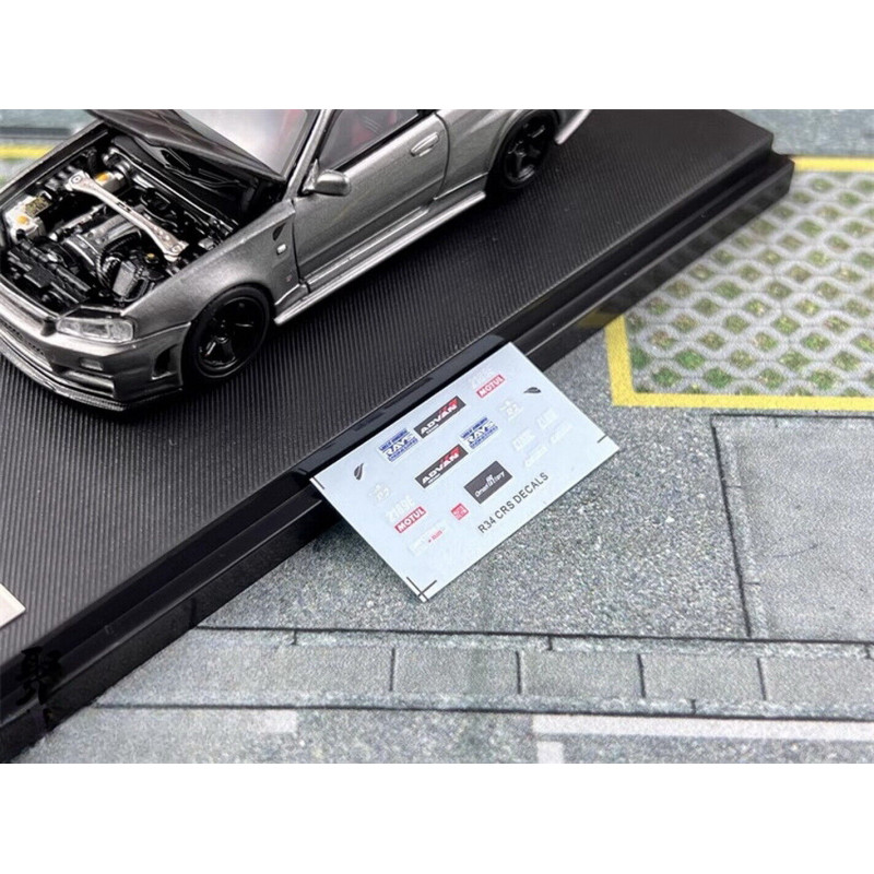 MOTORHELIX - 1/64 - NISSAN - SKYLINE GT-R (R34) NISMO CRS 2002 - GUN GREY